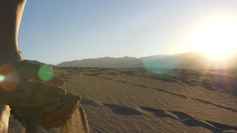 Slow Motion of Falling Sand From Female ... | Stock Video | Pond5