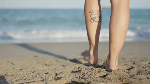 Slow motion of female feet walking along... | Stock Video | Pond5