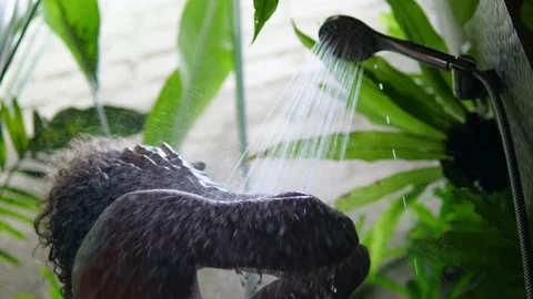In slow motion, a girl takes a shower in... | Stock Video | Pond5