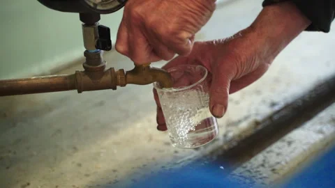 Slow Motion of Hand Turning Tap to Colle... | Stock Video | Pond5
