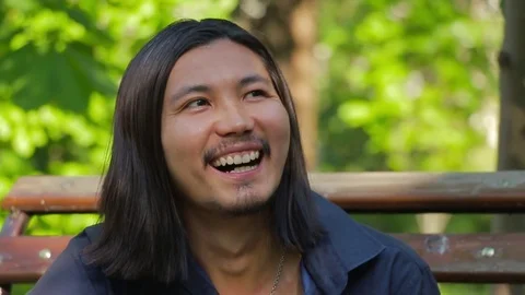 Slow motion of a handsome asian guy look... | Stock Video | Pond5