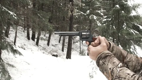 Slow Motion Hunter Shooting Revolver Gun | Stock Video | Pond5