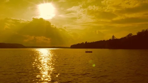 Slow motion lake with sunset highlights ... | Stock Video | Pond5