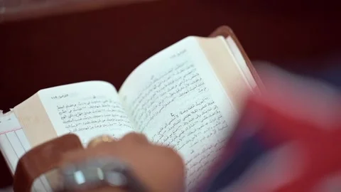 Slow motion of a man turning the pages o... | Stock Video | Pond5