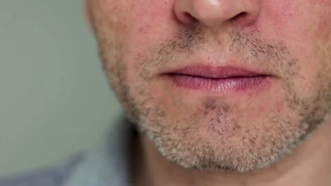 Slow motion of man's lips smiling. Conce... | Stock Video | Pond5