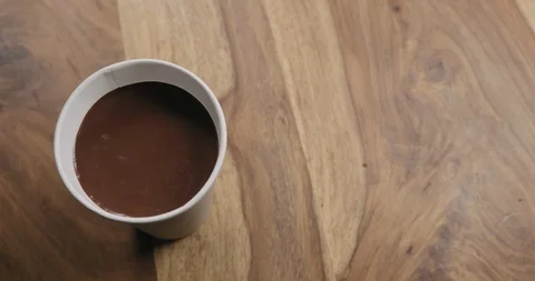 Slow motion paper cup with hot cocoa on ... | Stock Video | Pond5