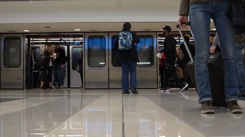 Slow motion people walking off and on th... | Stock Video | Pond5