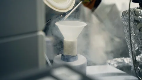 Slow motion pouring liquid nitrogen thro... | Stock Video | Pond5