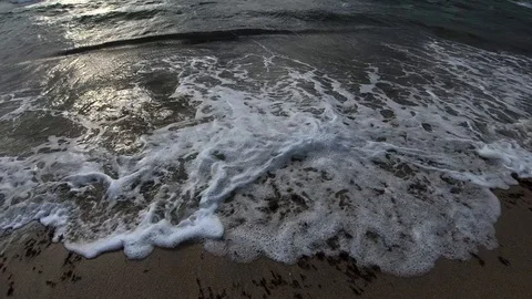 Slow motion right pan moving waves hitti... | Stock Video | Pond5