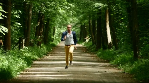 slow motion of running man. facing camer... | Stock Video | Pond5