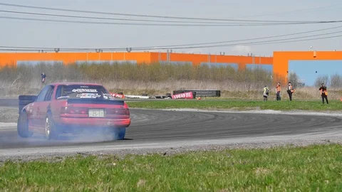 Slow motion shot of a drifting red car o... | Stock Video | Pond5