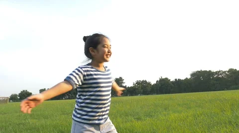 Slow motion shot : Happy Asian little gi... | Stock Video | Pond5