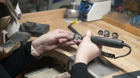 Slow motion shot of a jeweller using an ... | Stock Video | Pond5