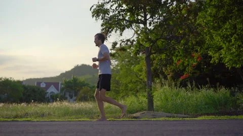 Slow Motion shot of a young man running ... | Stock Video | Pond5