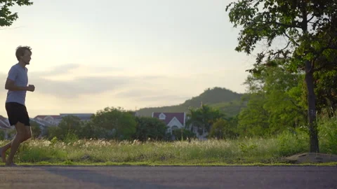 Slow Motion shot of a young man running ... | Stock Video | Pond5