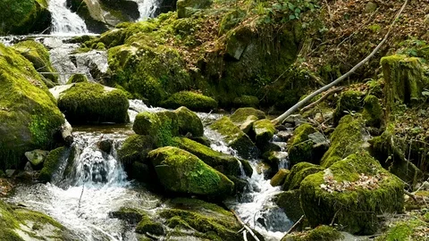 Slow motion of a small cascade waterfall... | Stock Video | Pond5