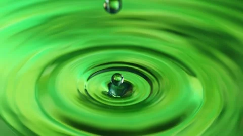 Slow motion of splashing water drop on g... | Stock Video | Pond5