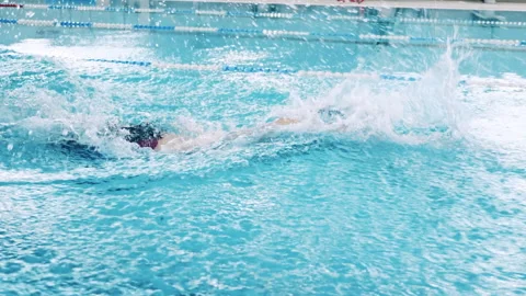 Slow motion of a swimmer moving along th... | Stock Video | Pond5