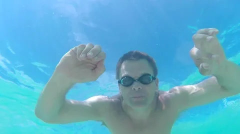 Slow motion underwater man swimming over... | Stock Video | Pond5