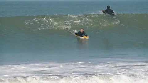 Slow motion video of a man surfing with ... | Stock Video | Pond5