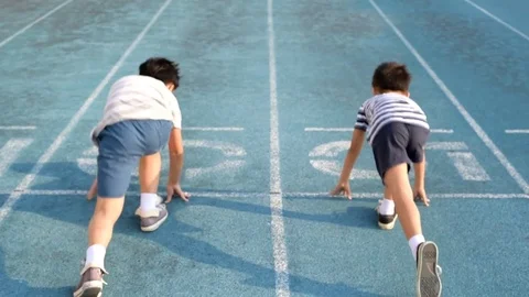 Slow motion Young Asian boy start to run... | Stock Video | Pond5