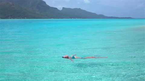 SLOW MOTION: Young woman swimming in fam... | Stock Video | Pond5