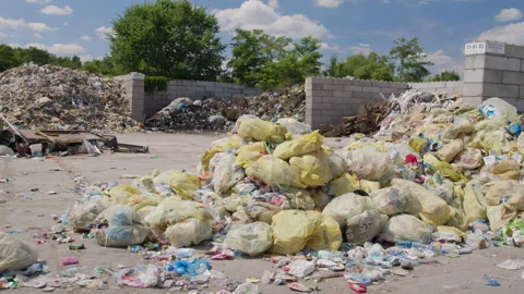 Slow pan of piles of garbage at outdoor ... | Stock Video | Pond5