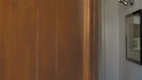 Slow shot of a door being opened with a ... | Stock Video | Pond5