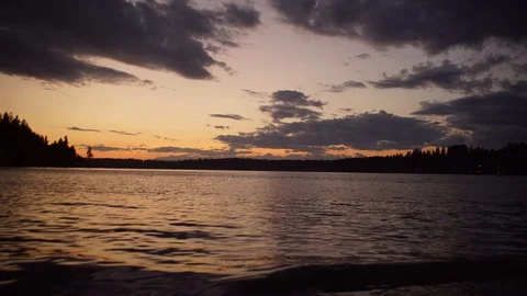 Slow zoom out on brilliant sunset sky se... | Stock Video | Pond5