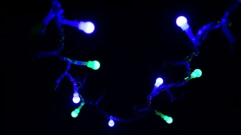 Slowly Blinking two garland lights on ... | Stock Video | Pond5