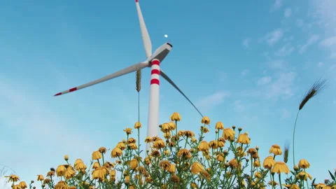 Slowly wind turbine generator over flowe... | Stock Video | Pond5