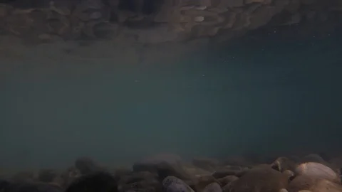 SLOWMO Underwater view of rock falling i... | Stock Video | Pond5