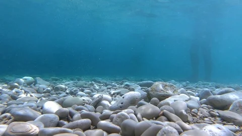 SLOWMO Underwater view of rocks falling ... | Stock Video | Pond5