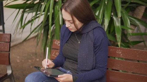 Slowmotion shot of a woman drawing on di... | Stock Video | Pond5