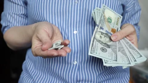 small and big money in hands, comparison... | Stock Video | Pond5