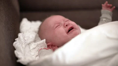 Small baby boy crying, detail to face | Stock Video | Pond5