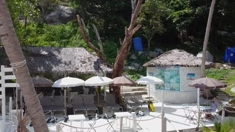 Small beach bar on the beach with sun lo... | Stock Video | Pond5