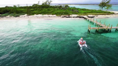 Small boat visiting Bimini Beach | Stock Video | Pond5