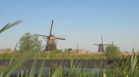 Small bridge leading over water canal to... | Stock Video | Pond5