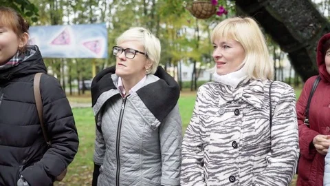 A small crowd of women gathered in the p... | Stock Video | Pond5