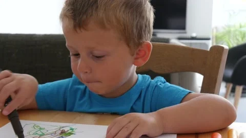 small cute boy drawings colored pencils ... | Stock Video | Pond5