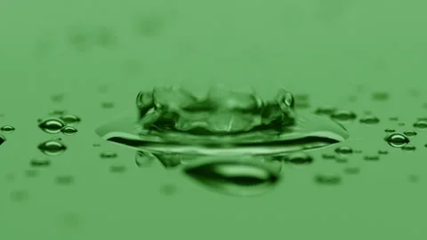 Small drop falls down on big one splashi... | Stock Video | Pond5