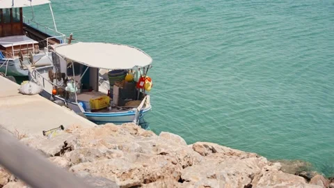 Small fishing boat rocking on sea water ... | Stock Video | Pond5