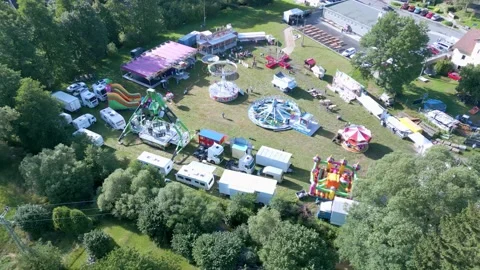 Small fun fair in the village with sever... | Stock Video | Pond5