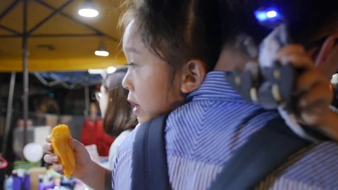 Small Girl Eating Jackfruit At Night Mar... | Stock Video | Pond5