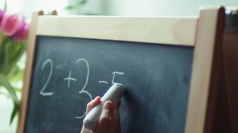 small girl practicing simple math on cha... | Stock Video | Pond5