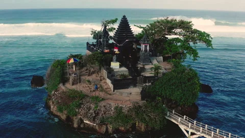 Small Hindu temple with a bridge on Bale... | Stock Video | Pond5