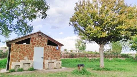 Small house with toilet and water tap fo... | Stock Video | Pond5