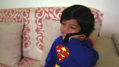 Small Indian Kid Talking in Cell Phone S... | Stock Video | Pond5