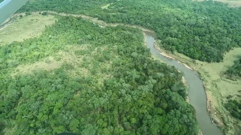 small plane flies over Tanzania | Stock Video | Pond5